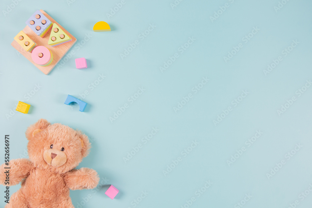 Baby kids educational toys frame background. Teddy bear, wooden ...
