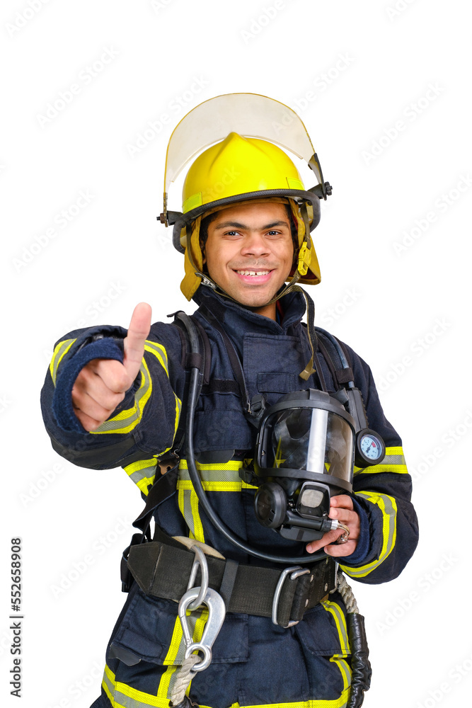 Young smiling African-American fireman in a fireproof uniform stands ...