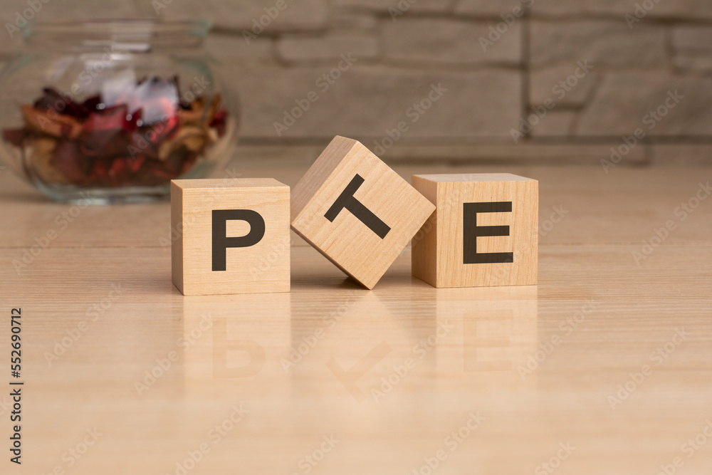 PTE - acronym from wooden blocks with letters, pearson tests of english ...