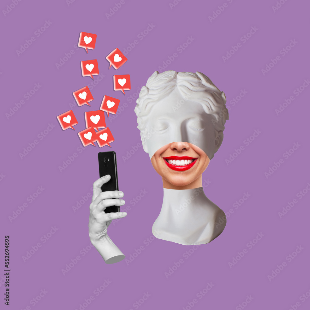 Antique smiling statue's head with red lips holding mobile phone with ...