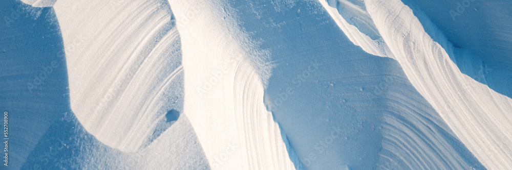 Snow texture. Wind sculpted patterns on snow surface. Wind in the ...