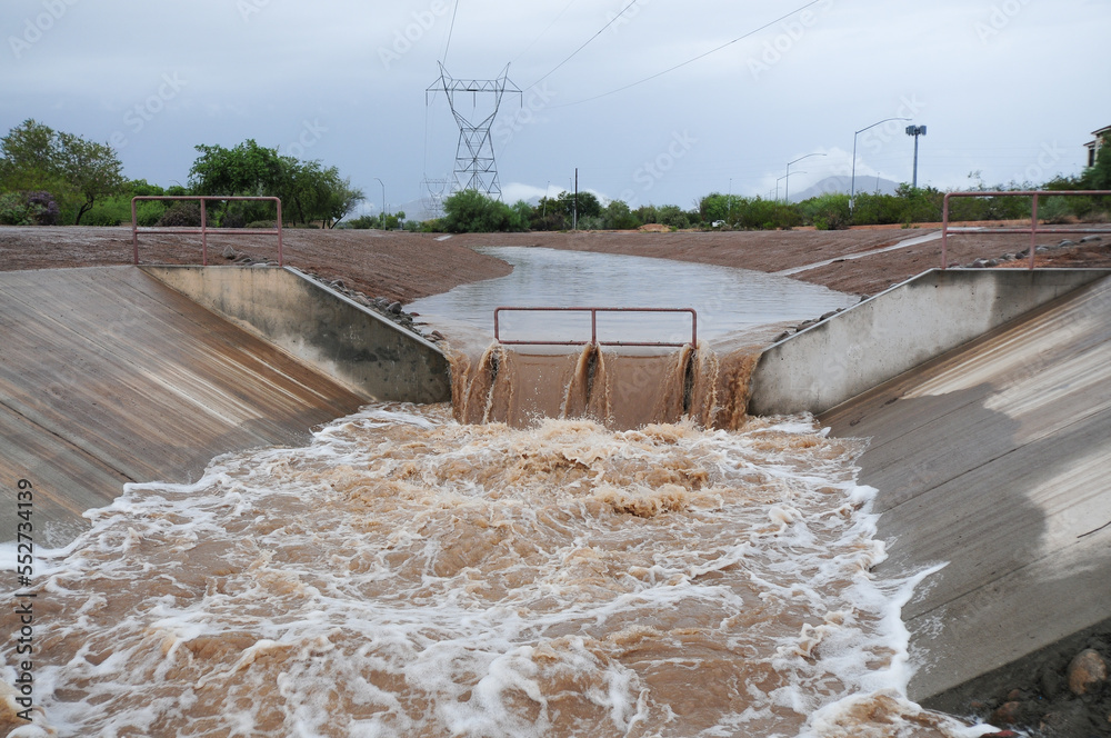 Stormwater runoff flowing in an open channel system after heavy rain in ...