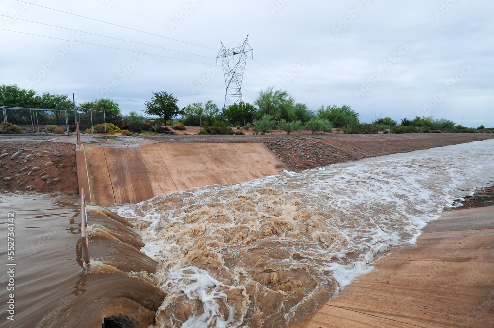 Stormwater runoff flowing in an open channel system after heavy rain in ...