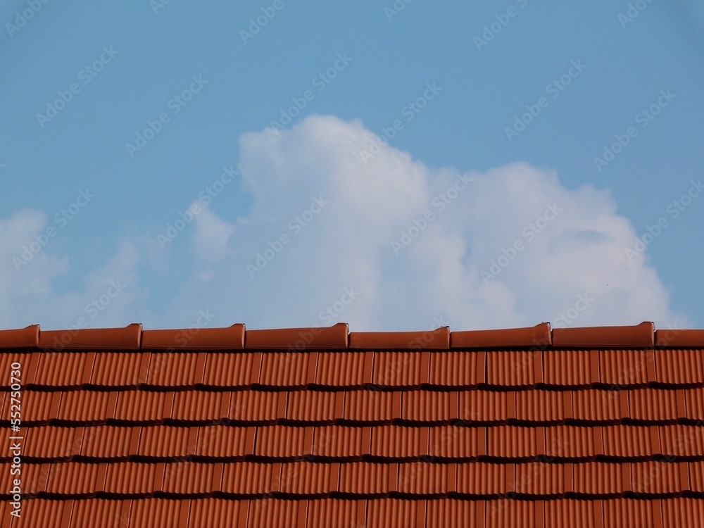 sloped red clay roof ridge detail. new bright clay house roof tiles ...