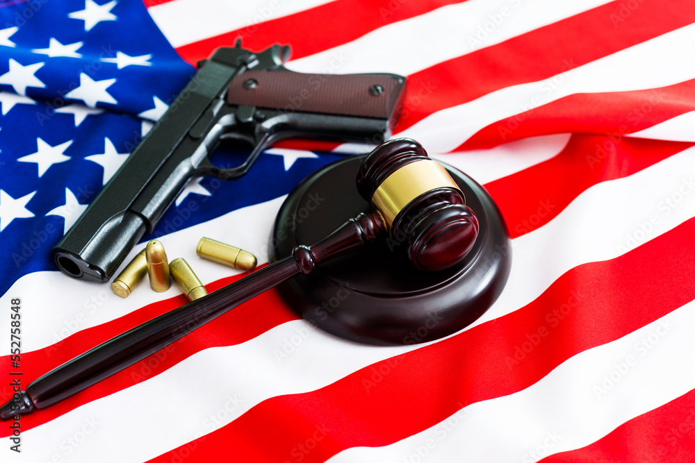 Gavel with gun over USA flag Stock Photo | Adobe Stock