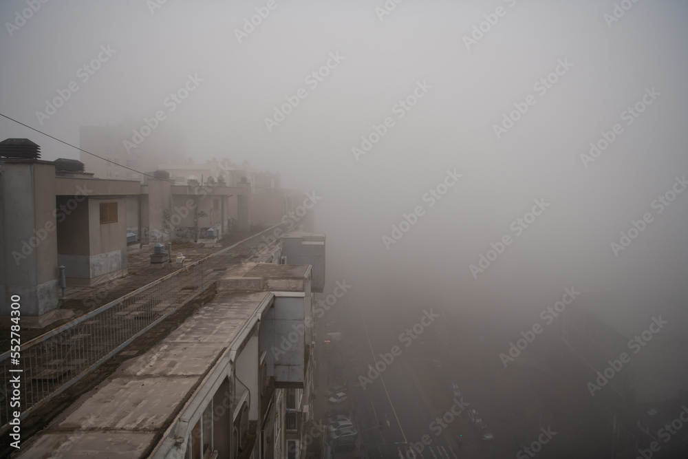 Smog and fog lies over the skyline of Historical architecture of ...