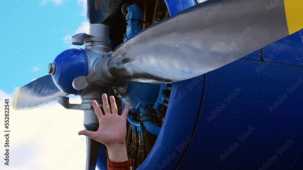 Camera moves up open palm of hand in red plaid shirt against backdrop ...