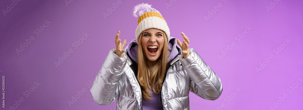 Outraged fed up pissed blond woman screaming out loud hateful bending ...