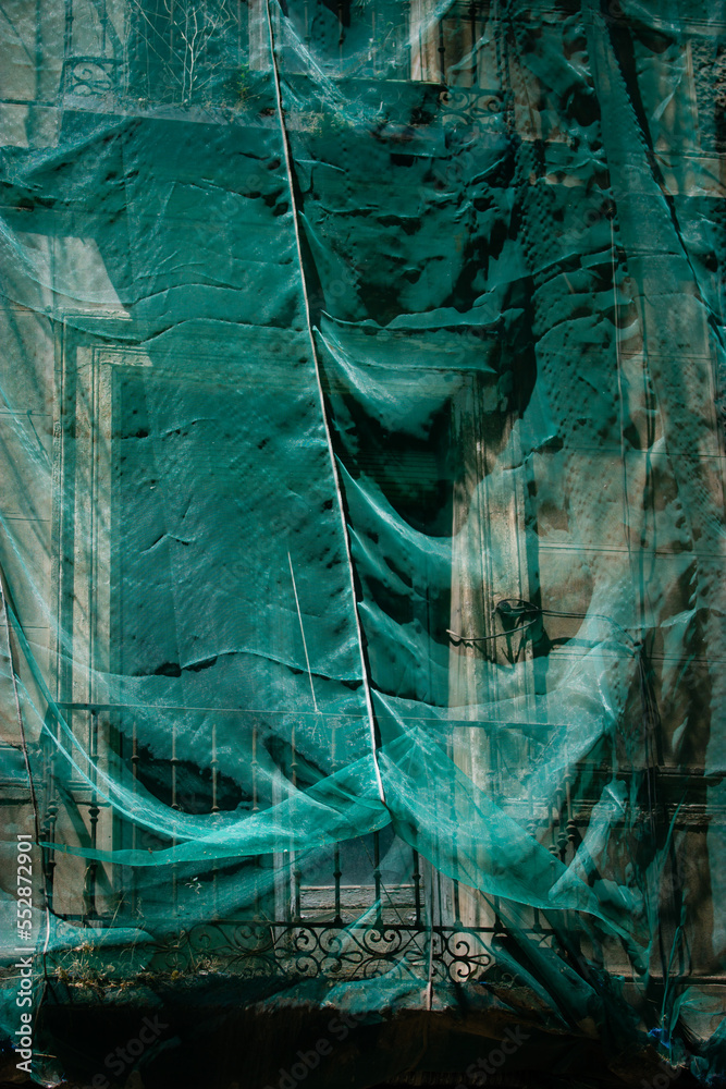 Protective net. Reconstruction of facade of historic classical ...