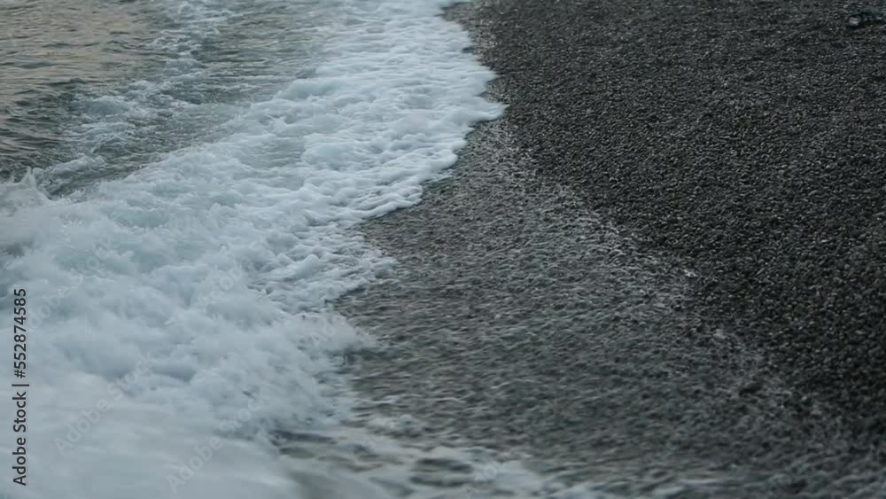 Gorgeous view of sea waves surge and break into the rocky shoreline ...