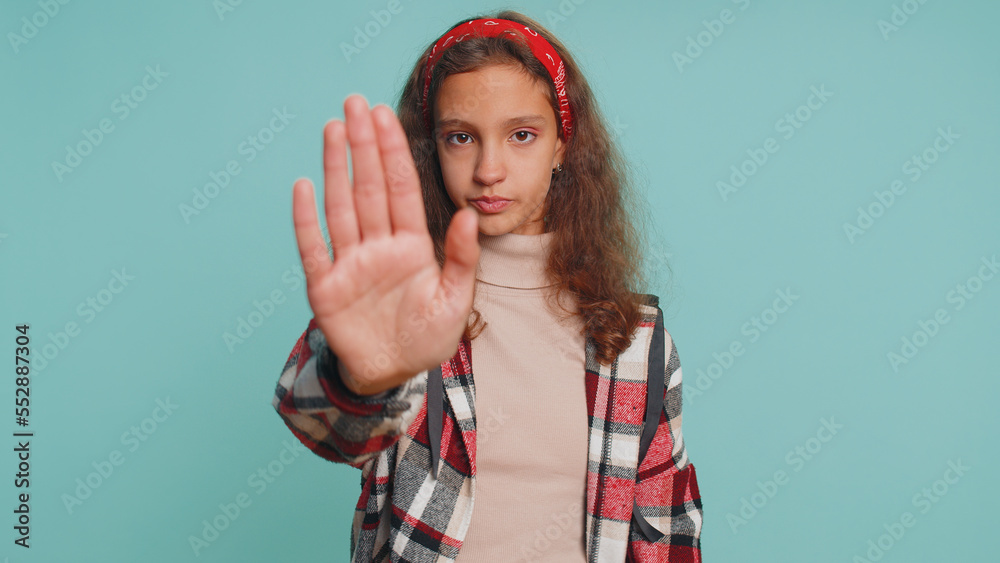 Stop gesture. Angry young preteen child girl kid say No hold palm ...