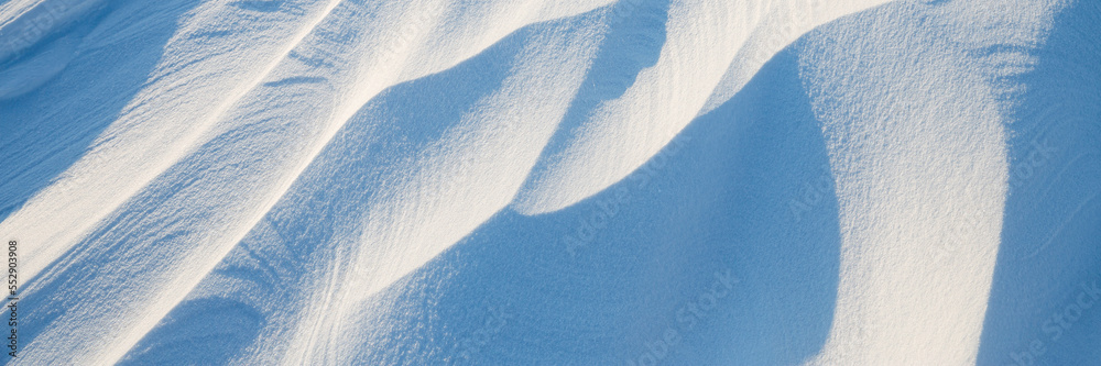 Snow texture. Wind sculpted patterns on snow surface. Wind in the ...