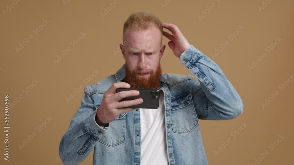 Portrait of a male gamer looking upset and unhappy. Caucasian man with ...