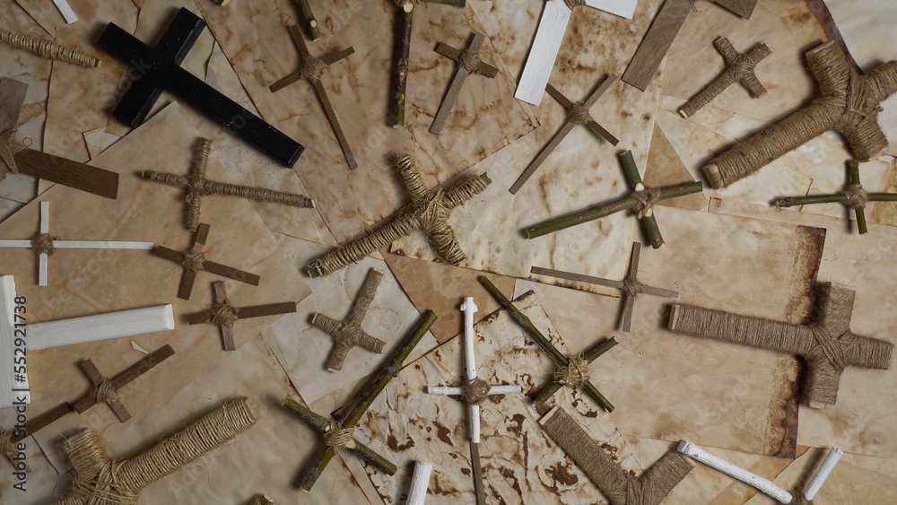 Wooden crucifixes cross on the ancient parchment paper. Handmade ...