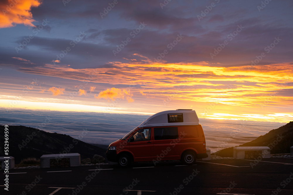 Camper van isolated in the sunset. Stock Photo | Adobe Stock