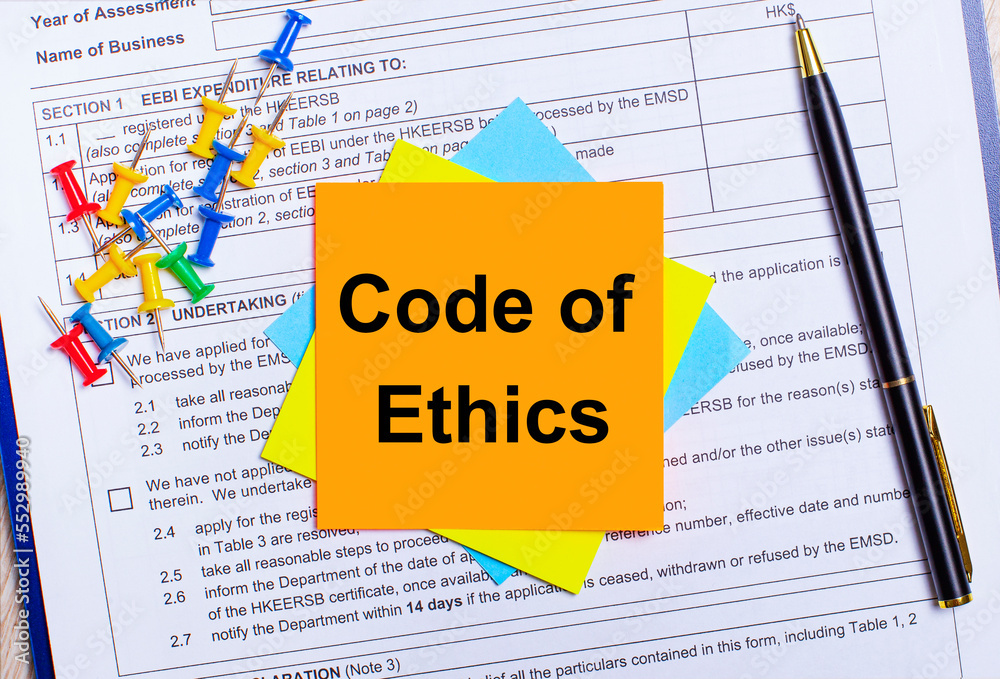 Colored stickers with the text CODE OF ETHICS, colorful paper fasteners ...
