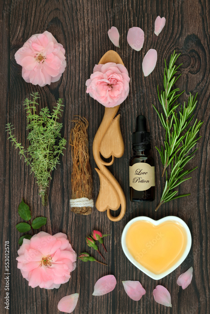 Romantic love potion concept with herbs, rose flowers honey and magical ...