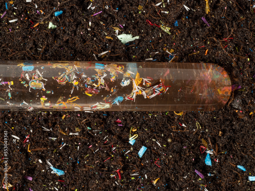 Microplastics in soil a test tube with soil sample - soil contaminated ...