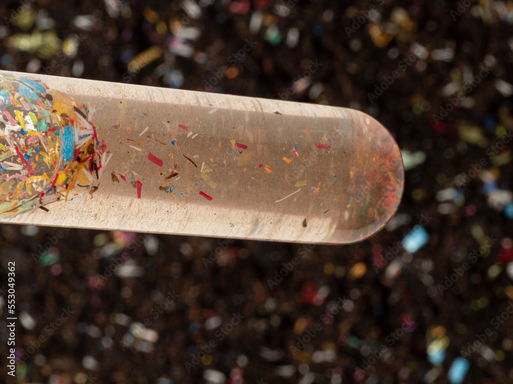 Microplastics in soil a test tube with soil sample - soil contaminated ...