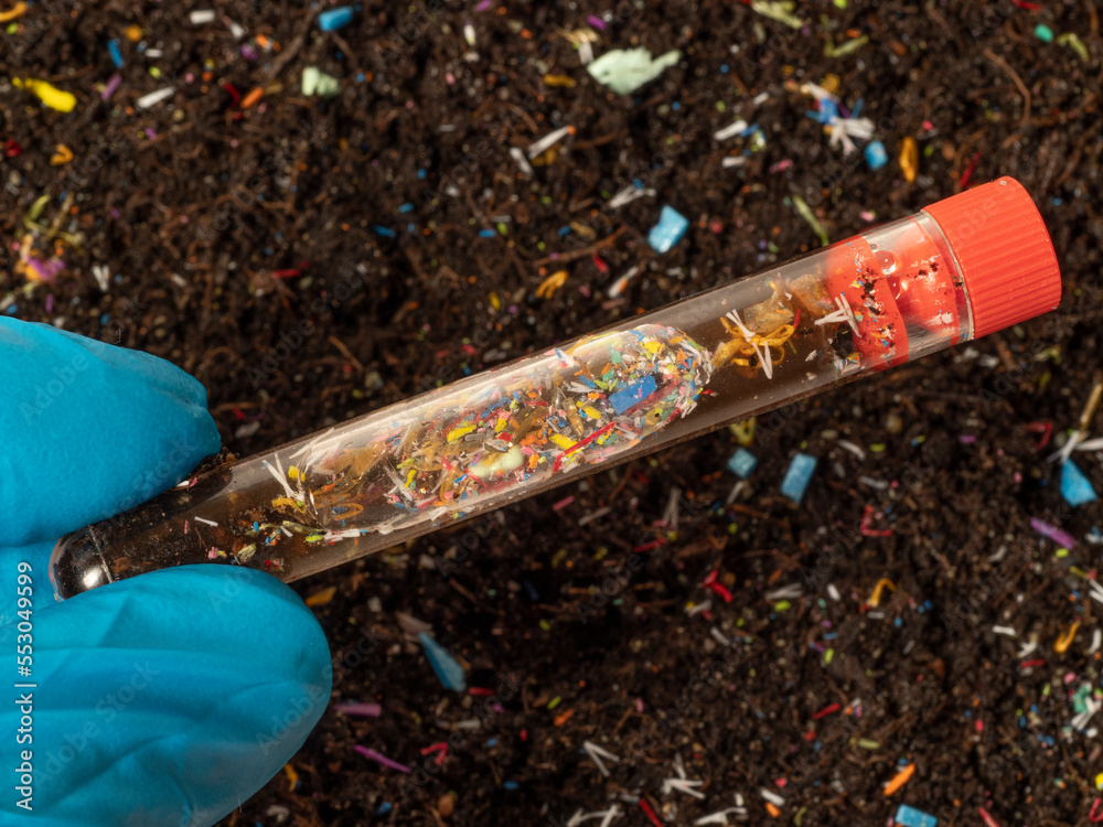 Microplastics in soil a test tube with soil sample - soil contaminated ...