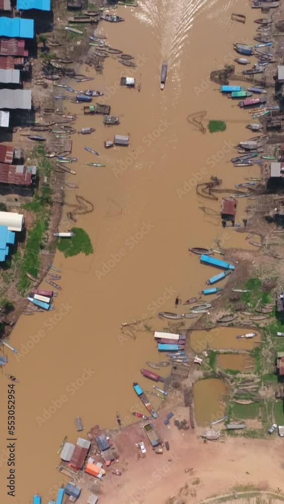 Vertical video of Drone footage of the stilt houses of Kampong Khleang ...