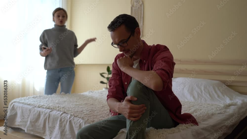 Young angry woman wife throwing away smartphone yelling at husband ...