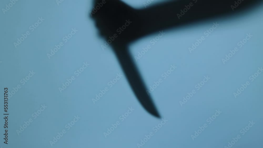 Shadow of the hand with big knife. Murderer, killer or robber. Horror ...