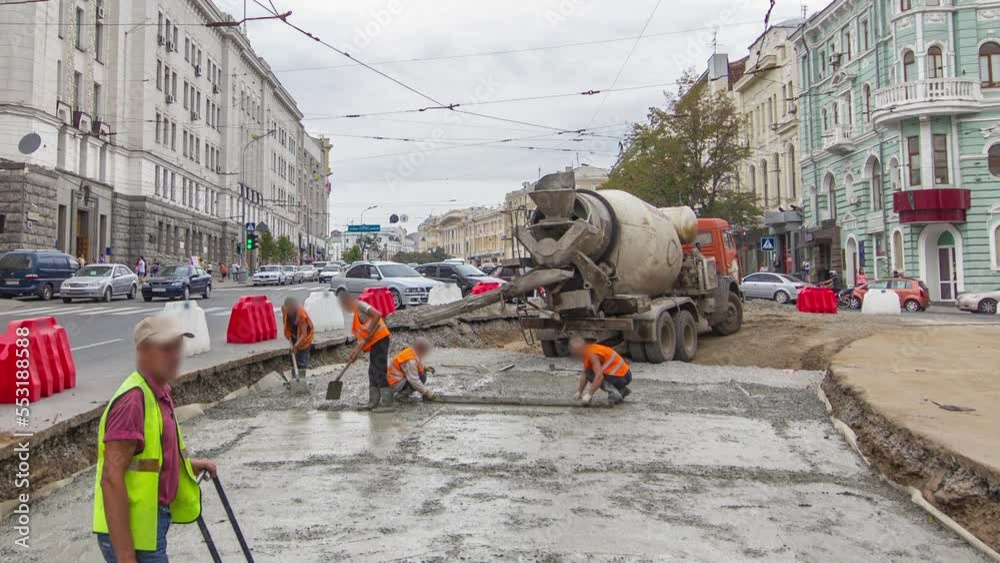 Concrete works and compaction for road construction site with many ...