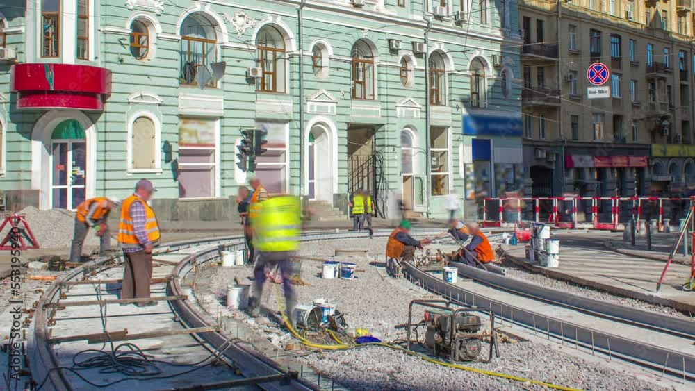 Repair works on the street timelapse. Laying of new tram rails on a ...