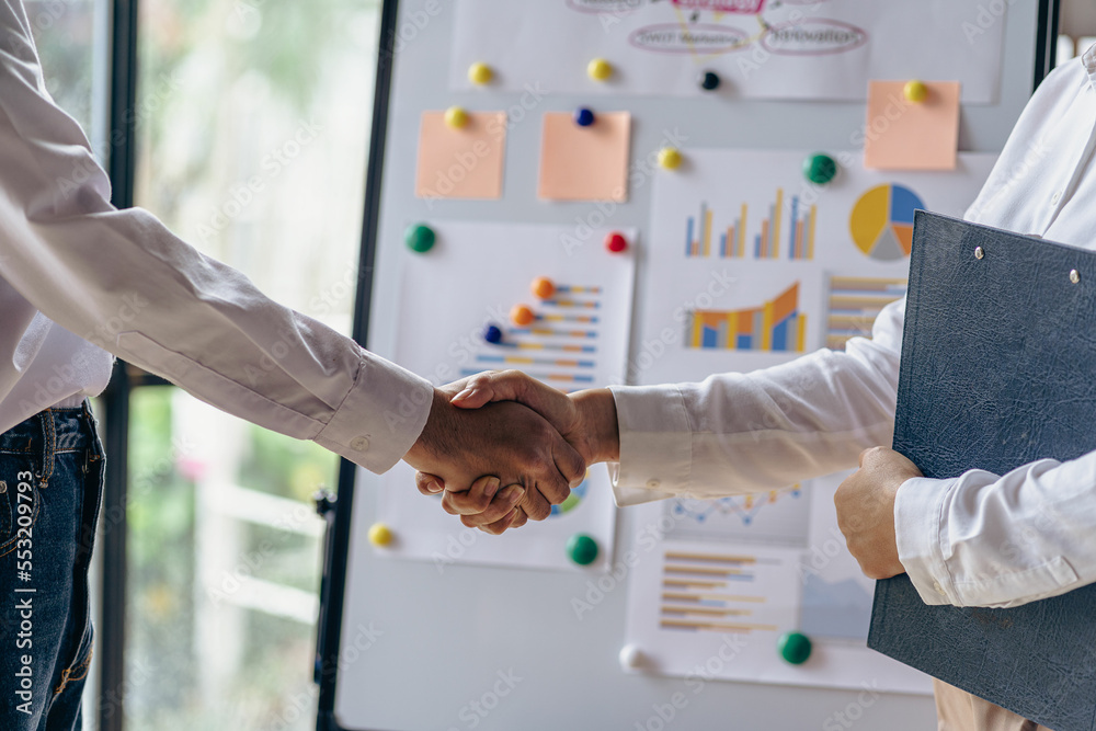business people shaking hands with customers in a modern conference ...