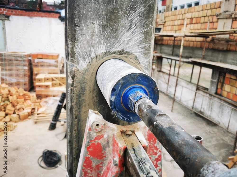 Hole cutting machine. Drilling concrete with an industrial drilling ...
