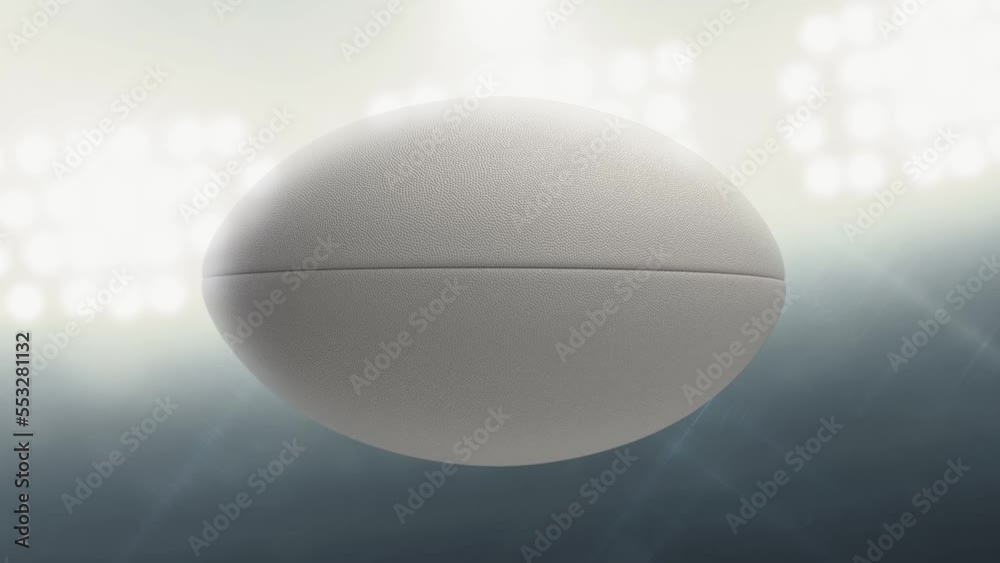 A seamlessly loop able animation of a white textured rugby ball ...