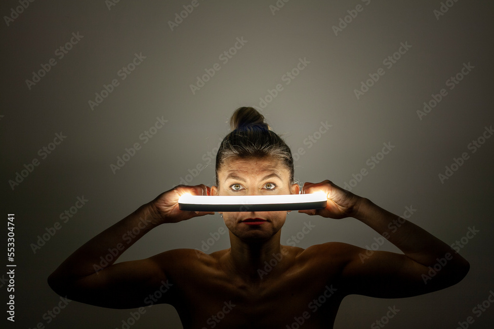 Blonde woman without clothes, only with a light ring showing her ...