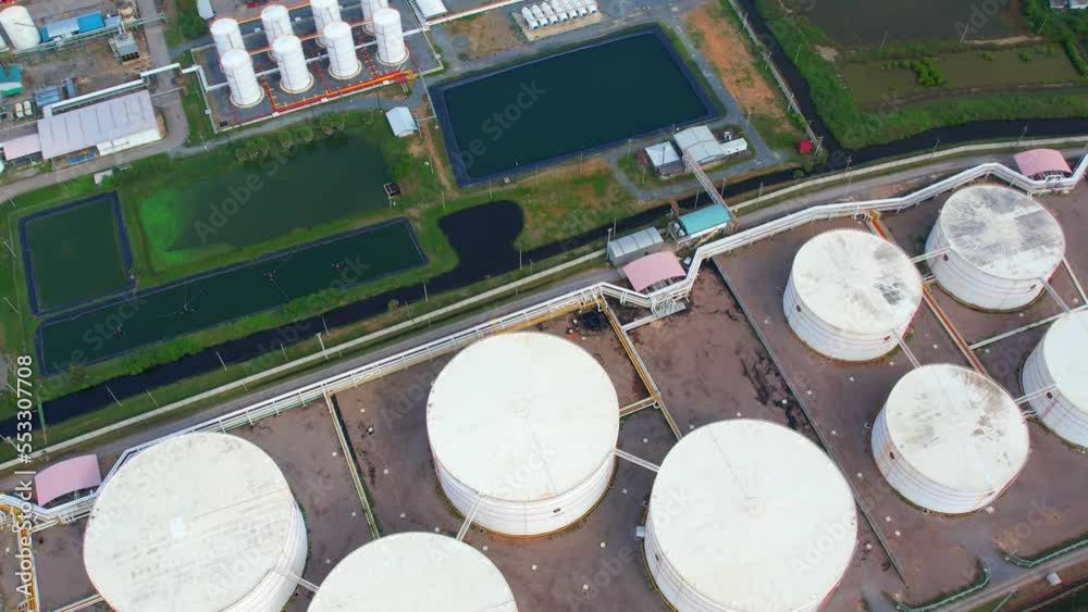Drone flying above a large oil storage tanks on the ground. crude, ULG ...