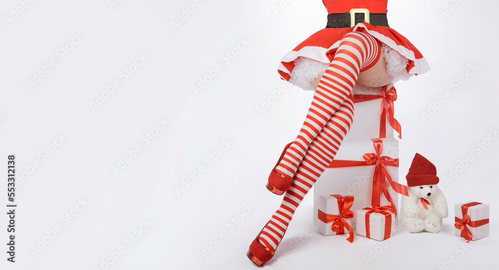 Sexy Santa Claus woman legs and christmas gifts. Beautiful sexy woman ...