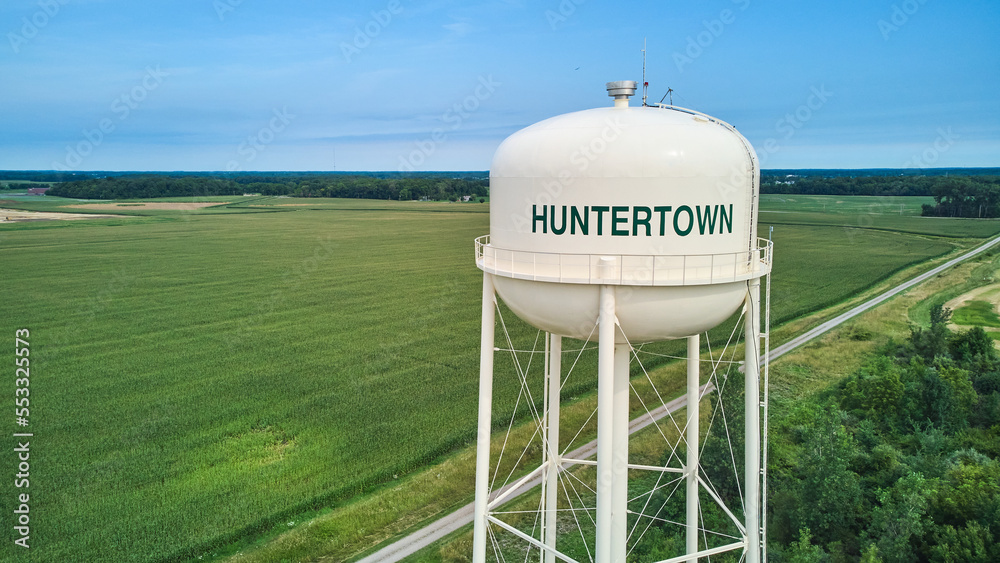 Aerial of Huntertown, Indiana water tower with farming fields ...