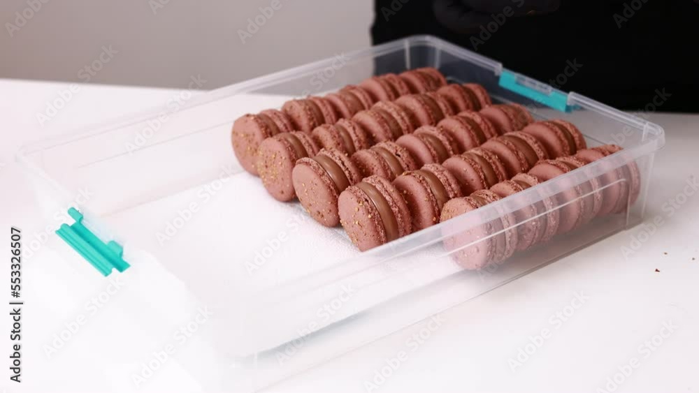 Ready french dessert chocolate macaron lay in plastic packaging for ...
