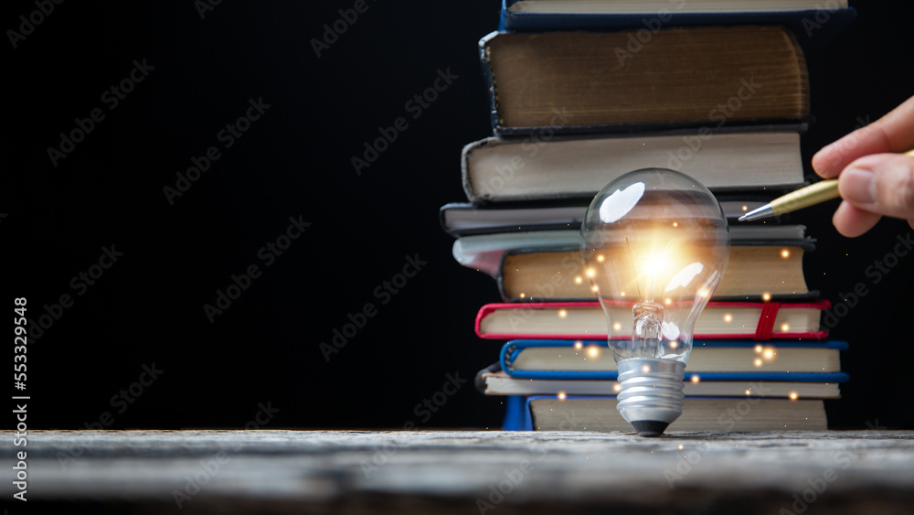 Light bulbs and books. Concept of reading books, knowledge, and ...