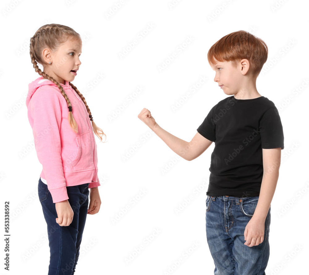 Boy with clenched fist looking at girl on white background. Children's ...