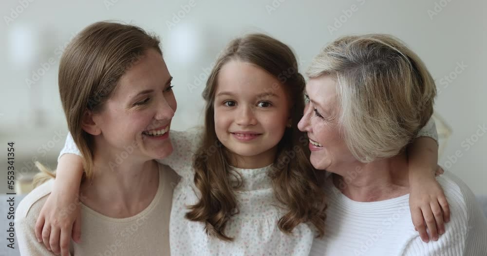 Close up portrait of three generational beautiful women smile look at ...