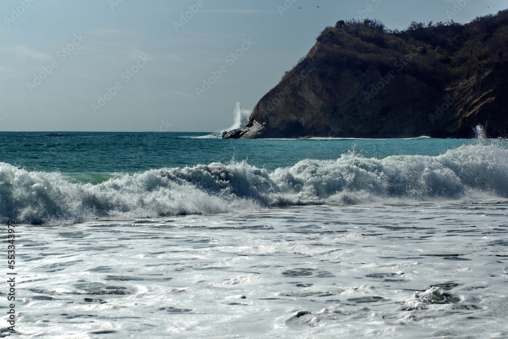 Los Frailes Beach, with a rocky cliff in the background, in Machalilla ...