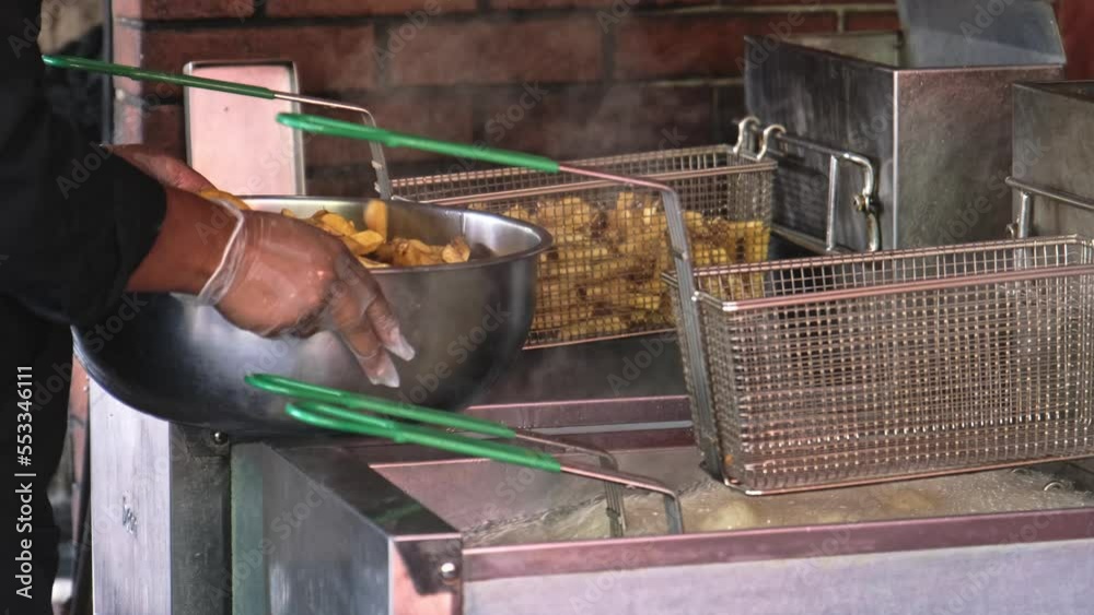 Fried Potato Production Process. Multiple Pieces of fried potato are ...