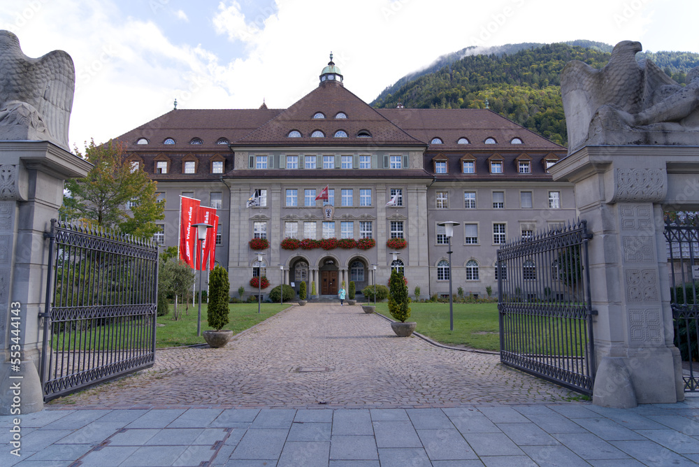 Headquarters of narrow gauge railway Rhätische Bahn RHB with flags at ...