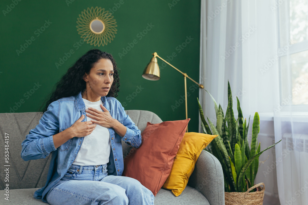 Panic attack woman alone at home scared hispanic woman having trouble ...