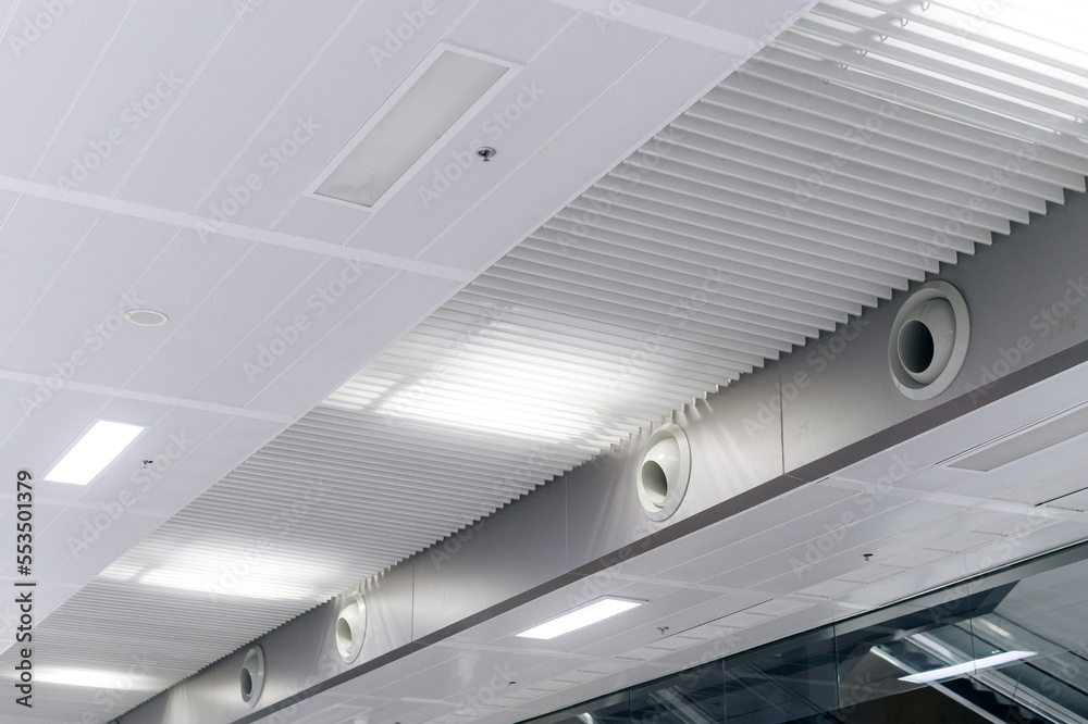 Ceiling mounted cassette type air conditioner and modern lamp light on ...