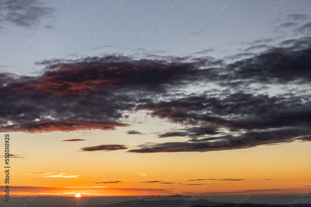 sunset at the top of the mountain with views of the clouds and the ...