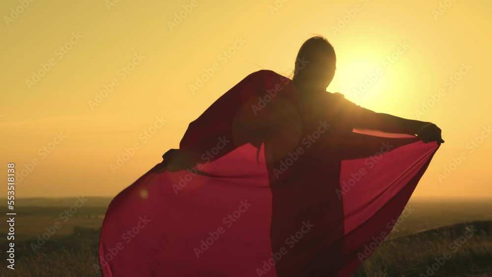 girl superhero sunset glare. game teenager red raincoat top mountain ...