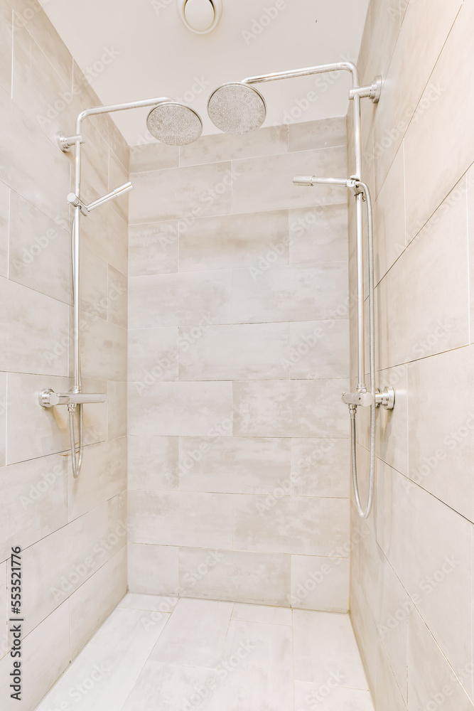 a walk in shower with tiled walls and white tile on the wall next to it ...