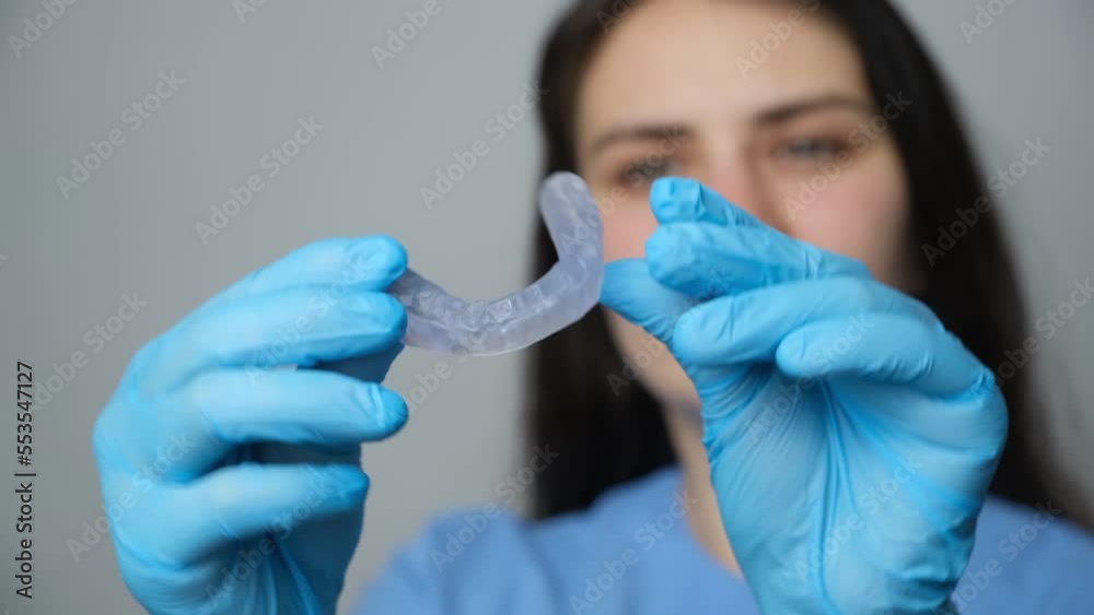 Doctor holding dental mouthguard, splint for the treatment of ...