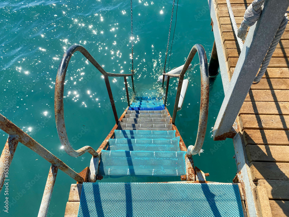 Iron railings and steps for descending into the sea on vacation in a ...